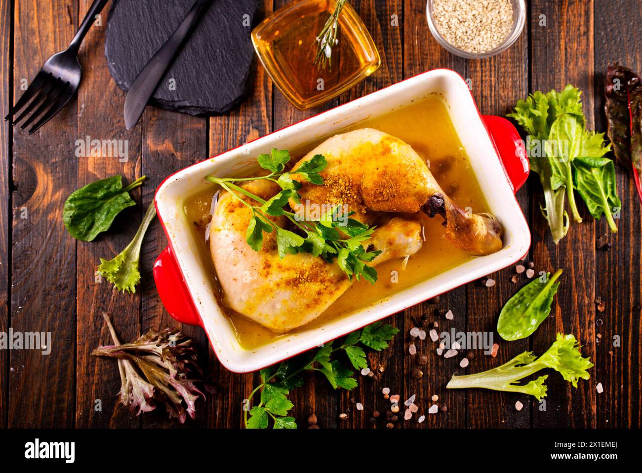 Cooked legs of chicken with spinach on plate. Balanced meal Stock Photo ...