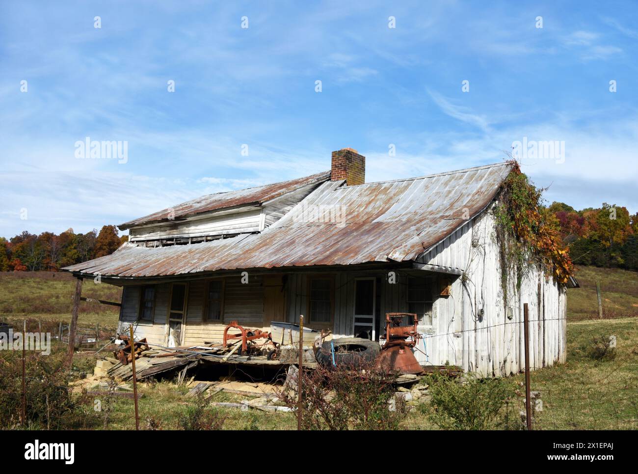 White, wooden farm house, is no longer occupied as a home. Farm ...