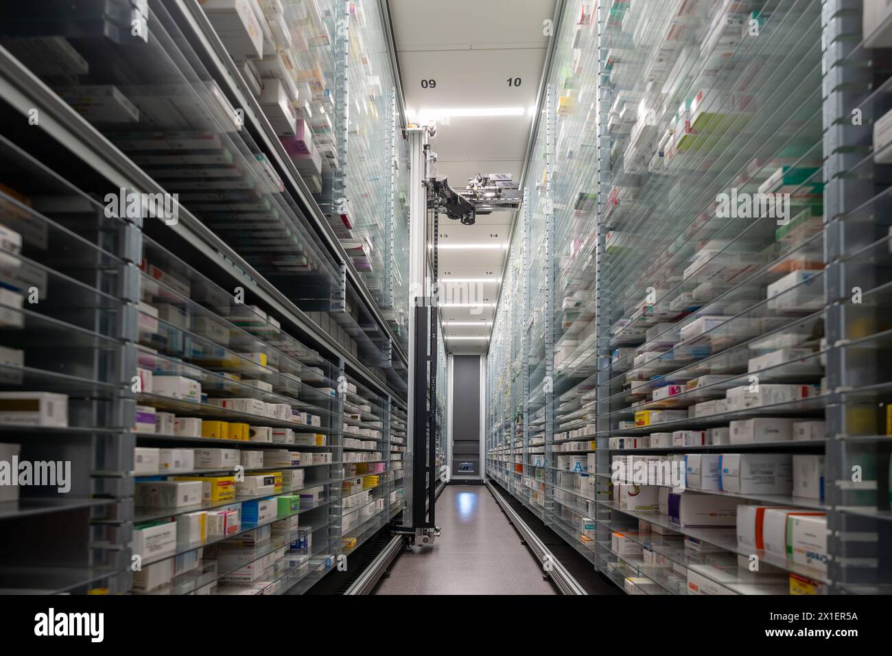 Photography of a pharmacy storage room and a robot hand are arranging ...