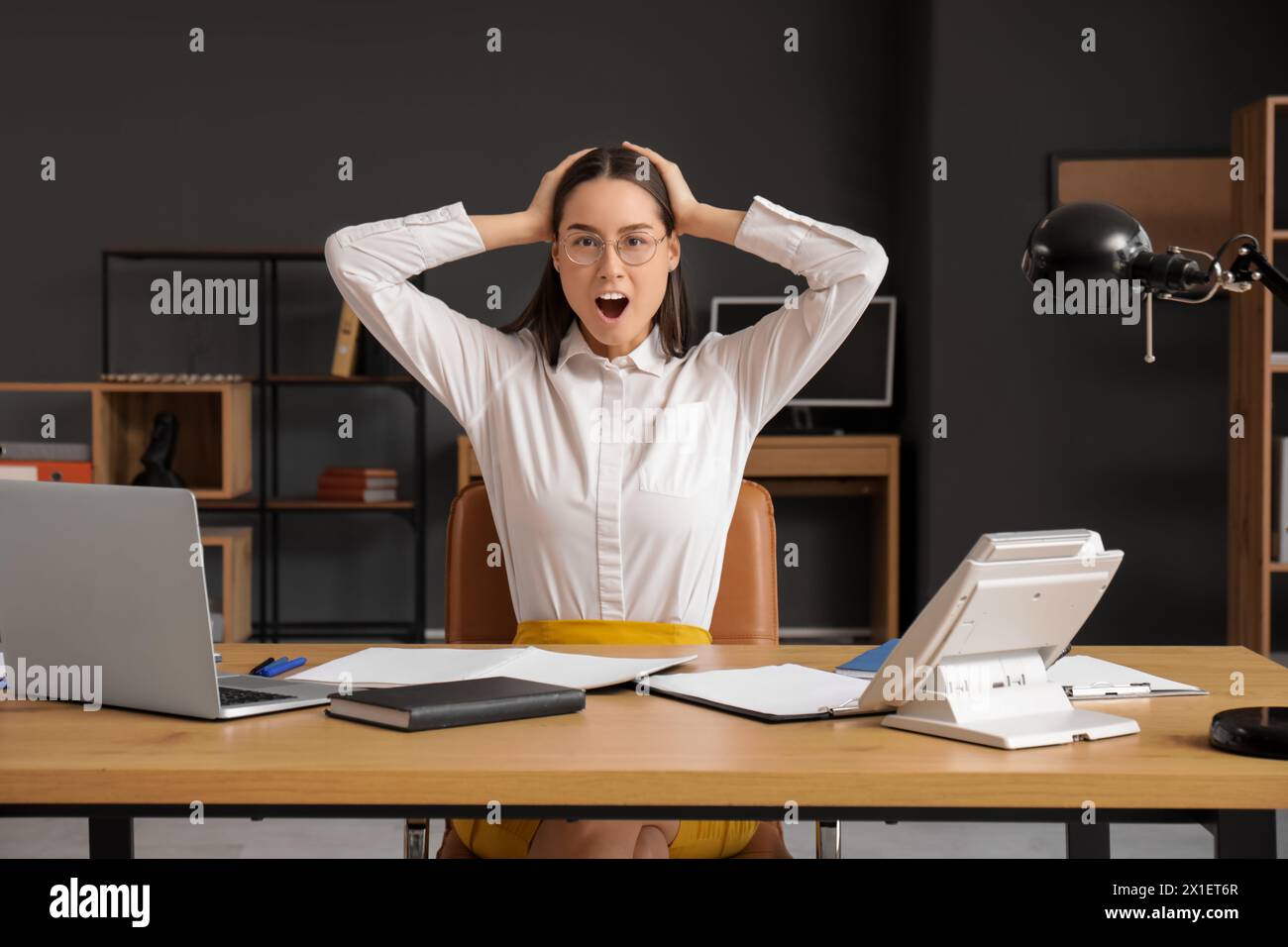 Young stressed secretary in hi-res stock photography and images - Alamy