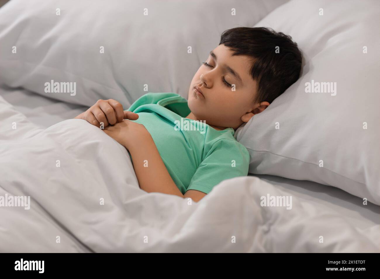 Cute little boy sleeping in bedroom at night Stock Photo - Alamy