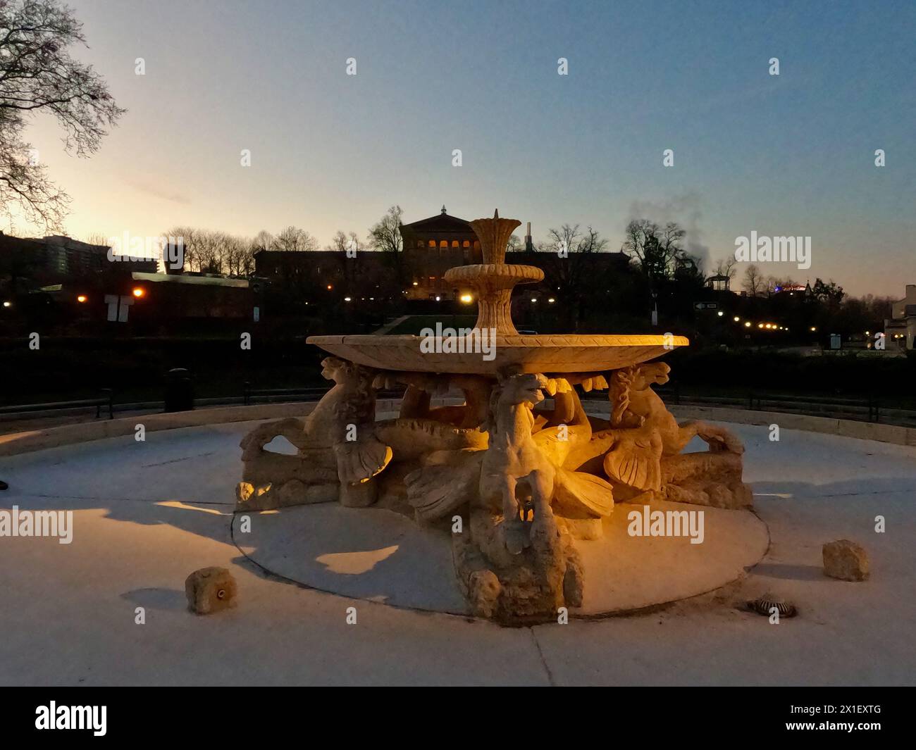 The Fountain of the Sea Horses is lit just before daybreak in early ...