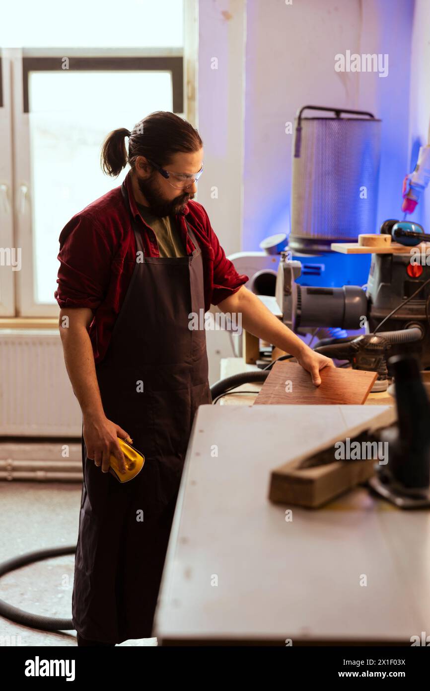 Artisan uses safety goggles to prevent workplace accidents while ...