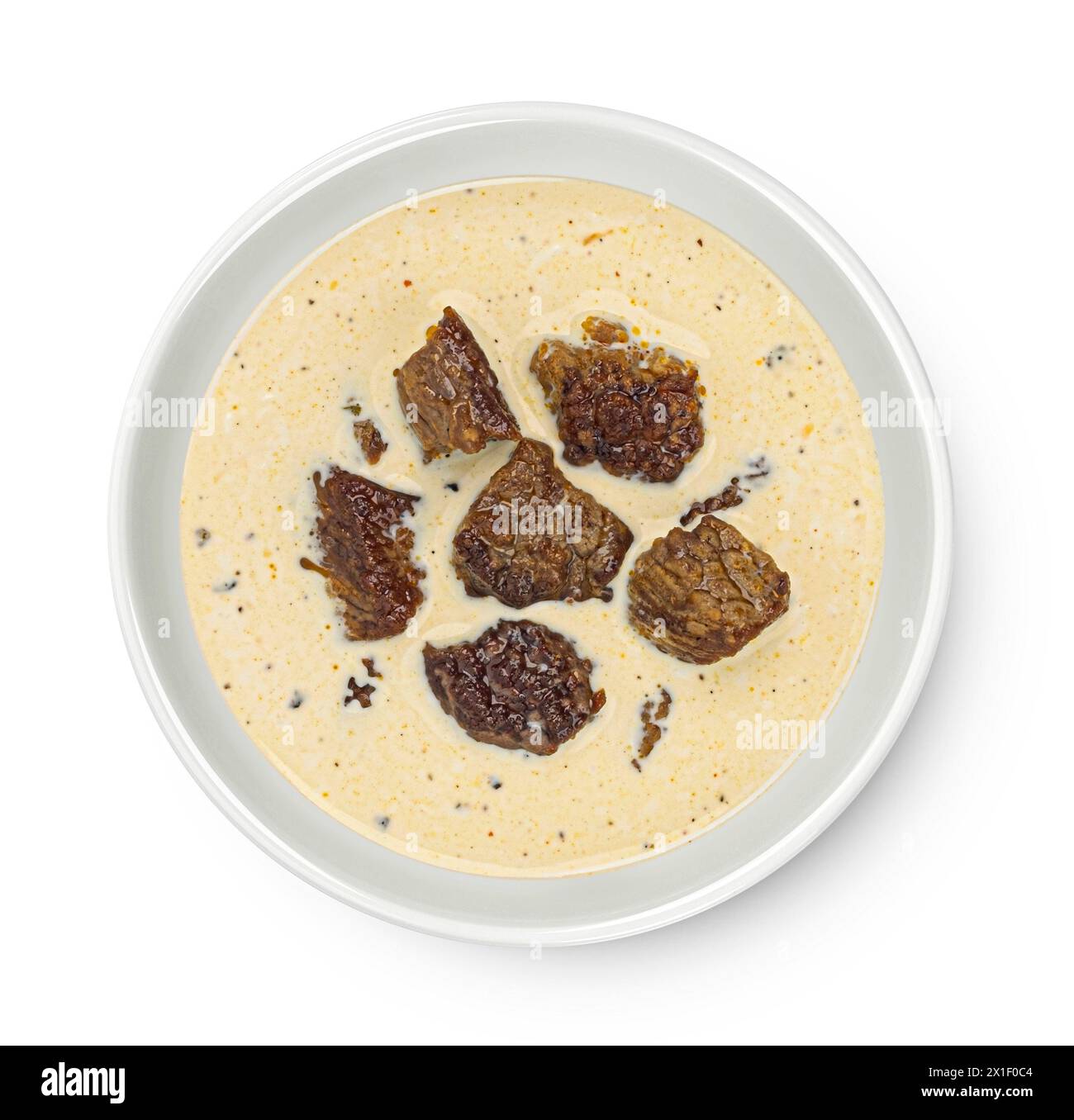 Meat goulash with cream sauce, beef stroganoff isolated on white ...