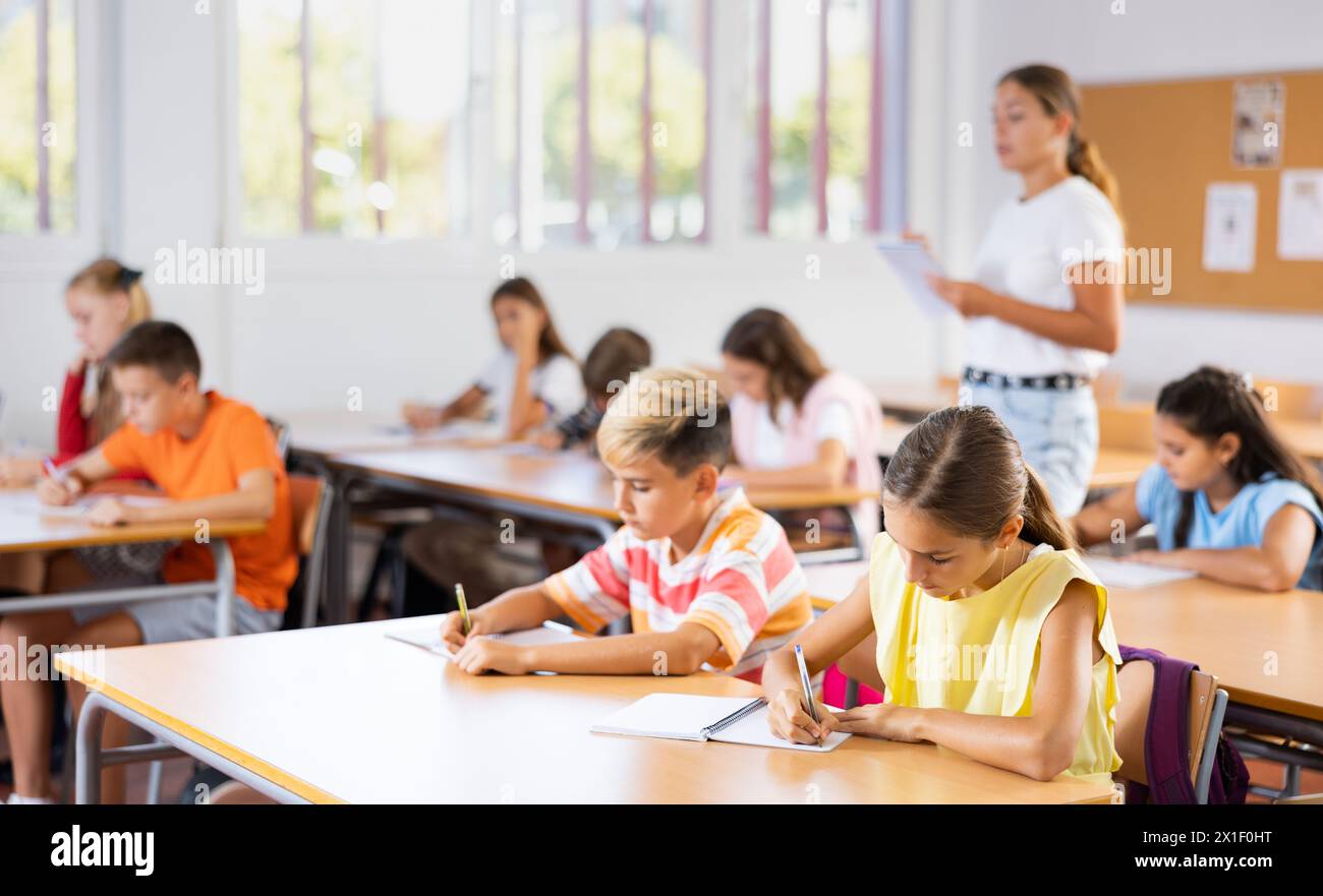 Boy and girl studying in classroom Stock Photo - Alamy