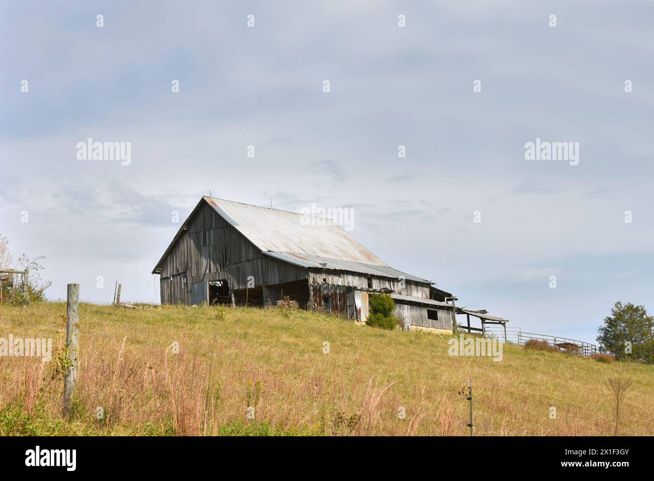 Old weathered barn sits on top of a hill in the Appalachian Mountains ...