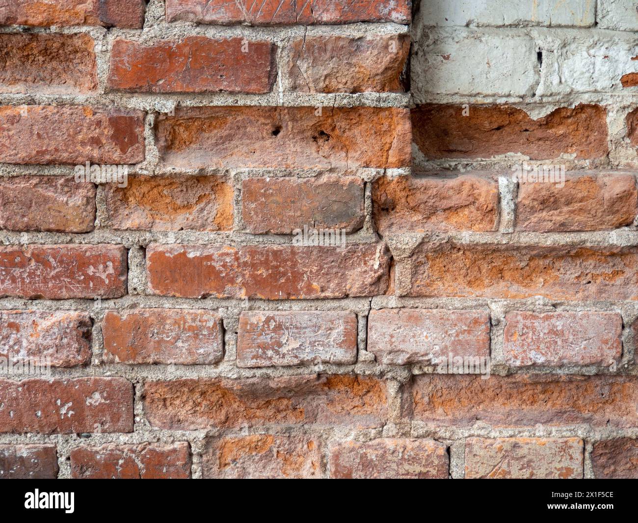 Red old brickwork. Chipped brick. Background from building materials ...