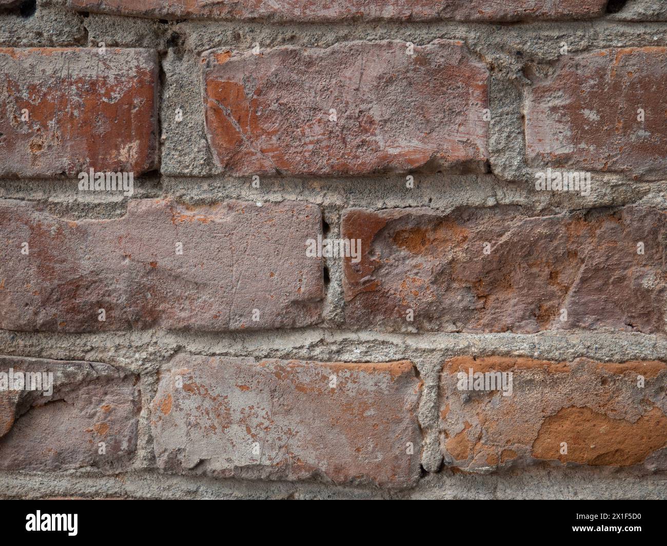 Red old brickwork. Chipped brick. Background from building materials ...