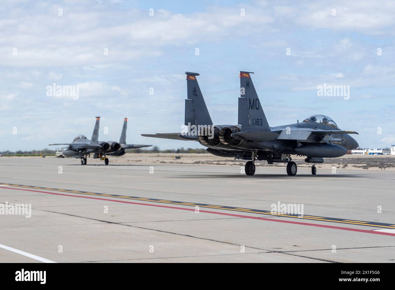 Two F-15E Strike Eagles assigned to the 389th Fighter Squadron prepare ...