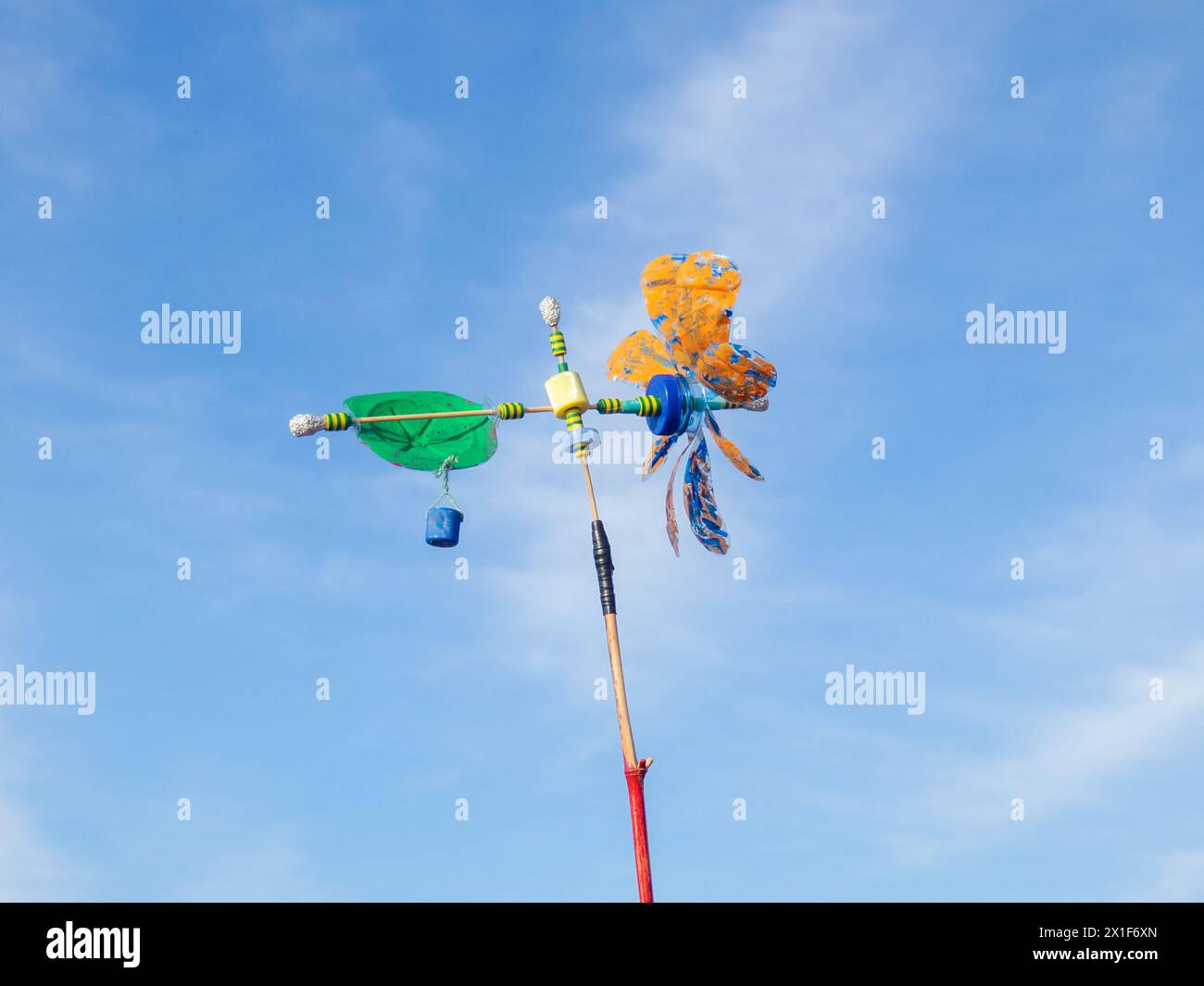 Homemade weather vane from a plastic bottle on the seashore. Wind ...