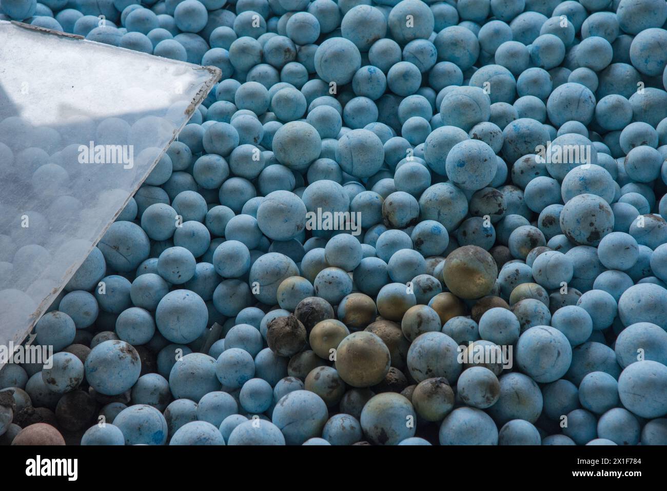 Blue dye balls in an abandoned manufacturing facility Stock Photo - Alamy