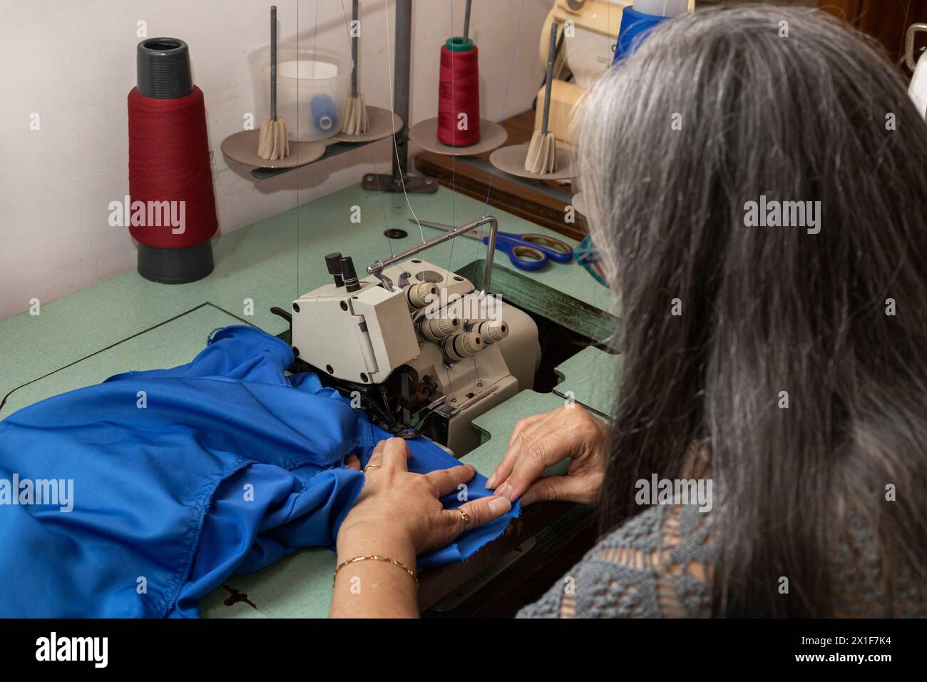Dressmaker working sewing machine close hi-res stock photography and ...
