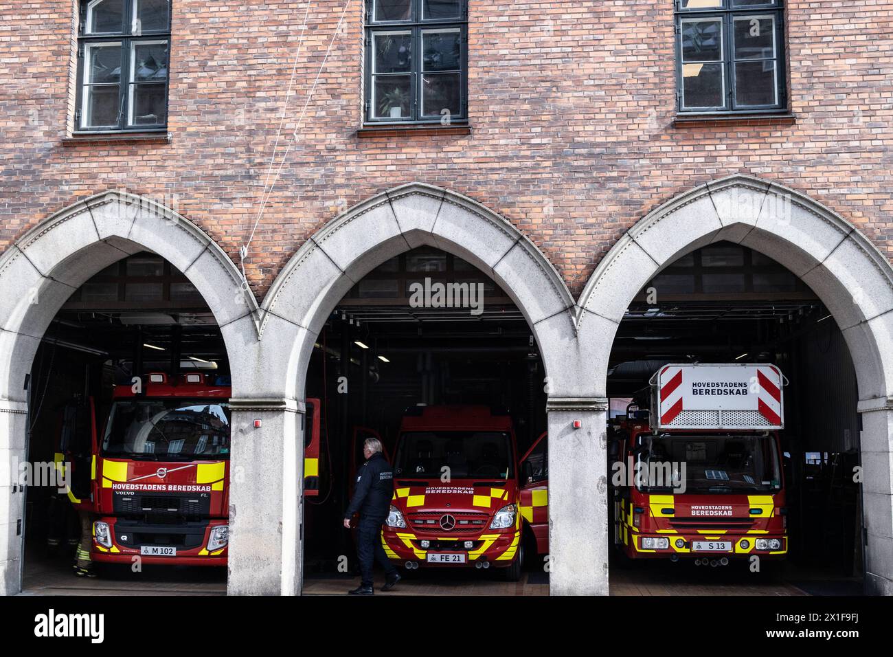Three Danish fire engines, fire trucks or fire ambulances with at Copenhagen Central Fire ...