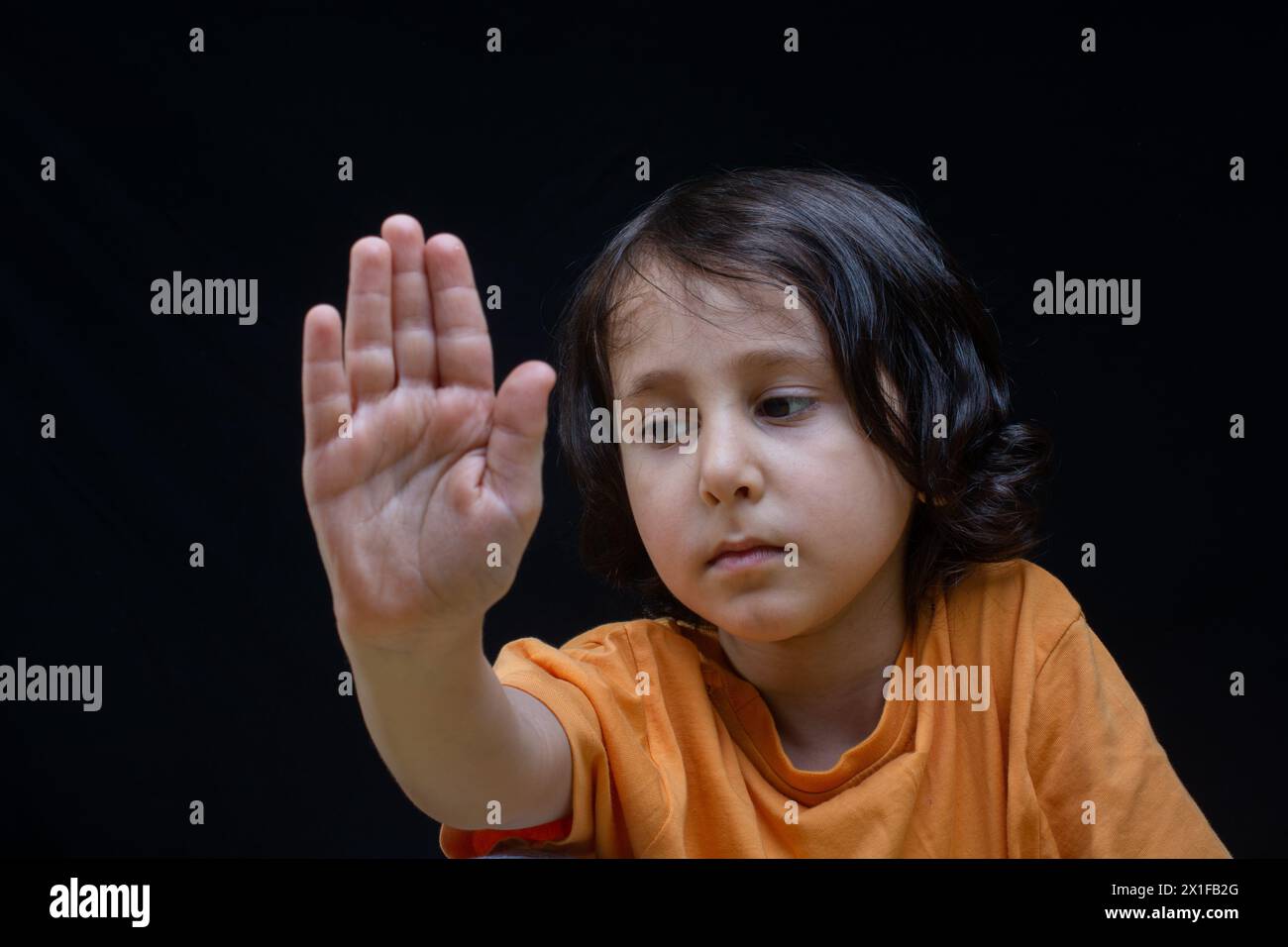 Boy showing stop gesture with his hand as prohibition concept Stock ...
