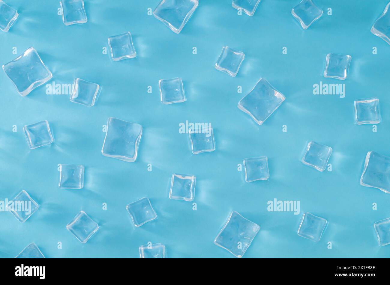 Ice cubes pattern on light blue background. Minimal summer drink ...