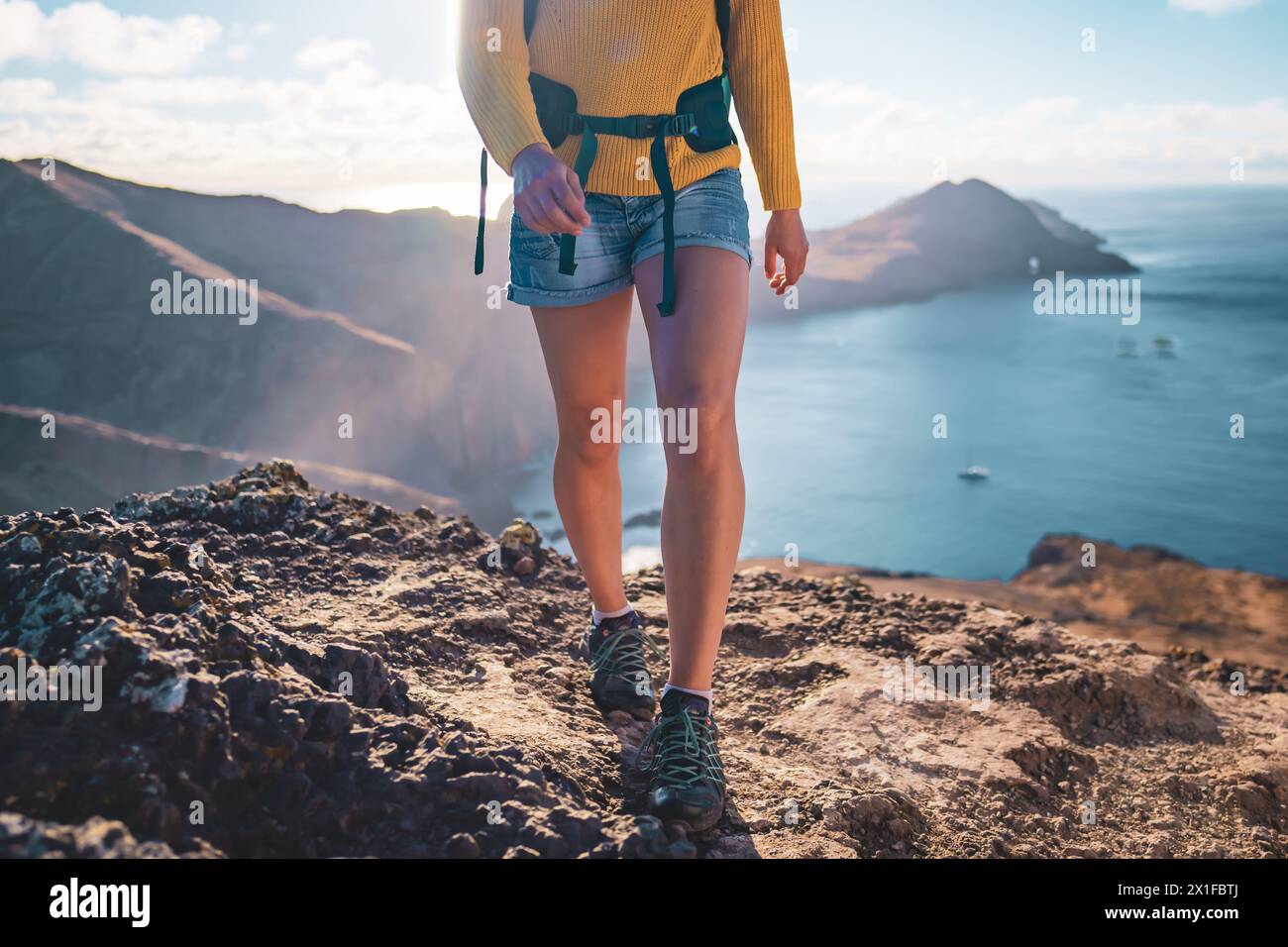 Description: Low angle front view of tourist backpacker legs walking on ...