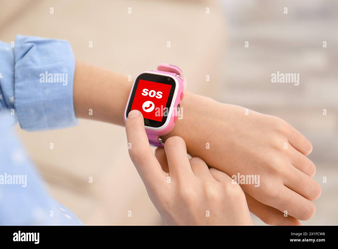 Little girl using SOS function on smartwatch indoors, closeup Stock ...