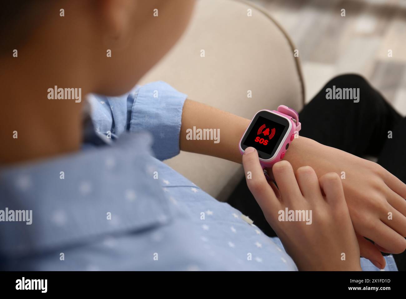 Girl using SOS function on smartwatch indoors, closeup Stock Photo - Alamy