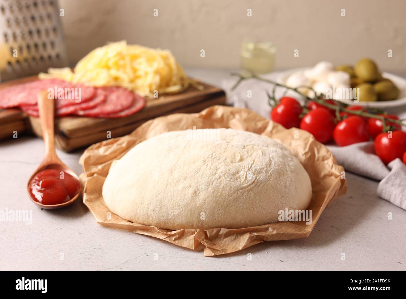 Pizza dough and products on gray textured table, closeup Stock Photo ...