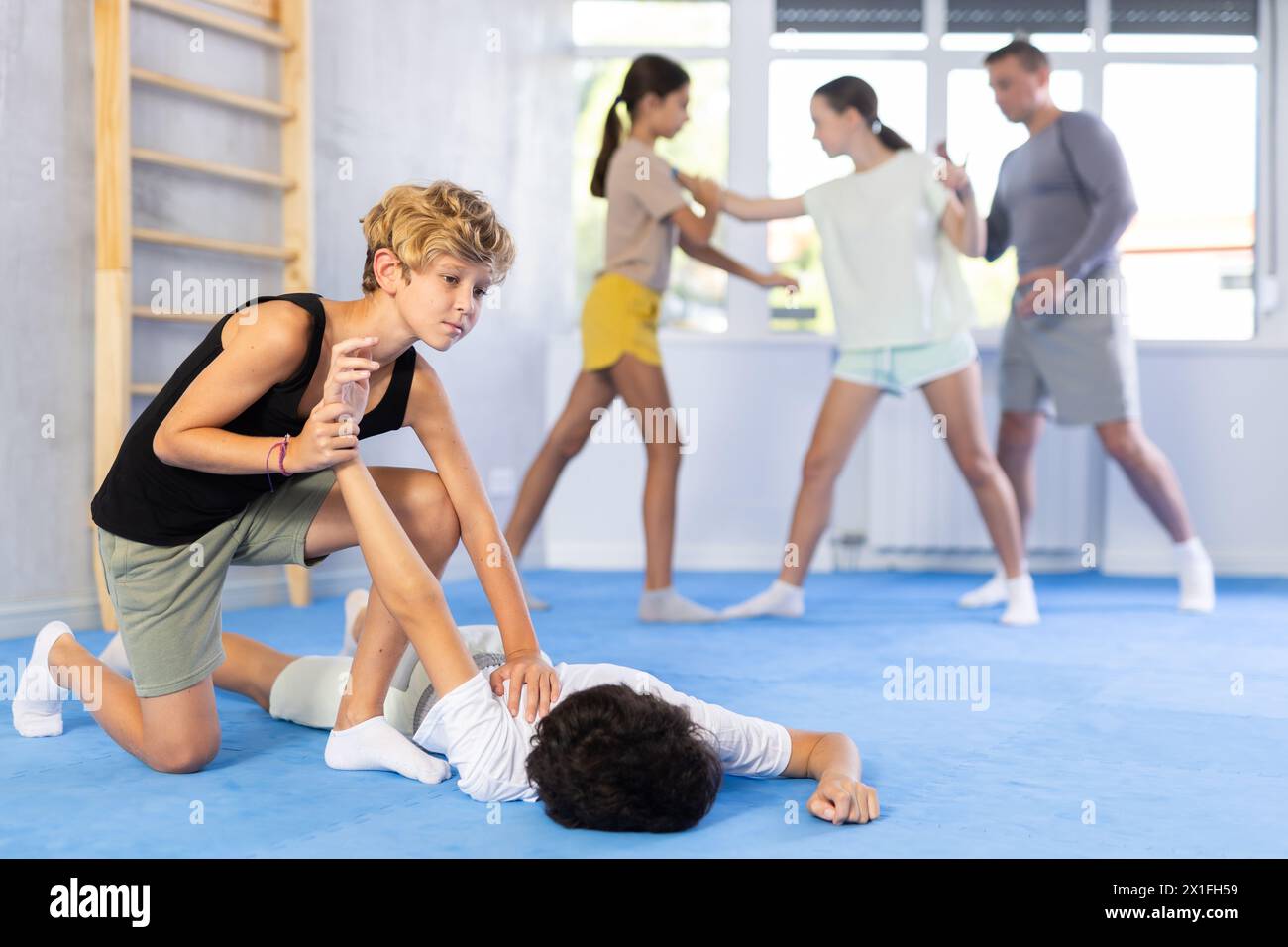 Two boys practicing self-defense techniques Stock Photo - Alamy