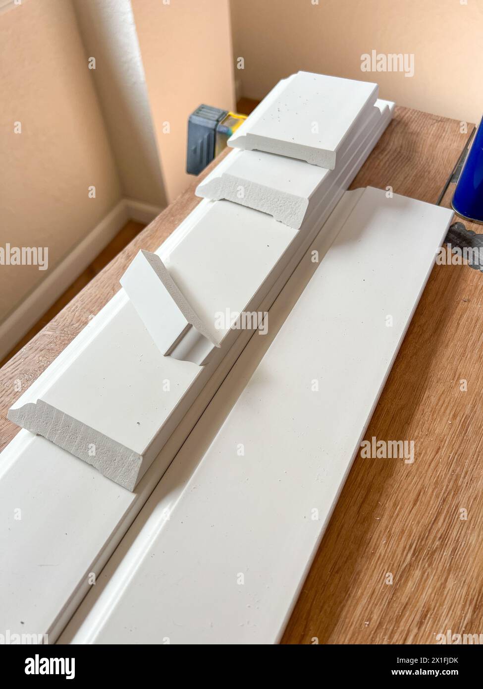 Installing Vinyl Baseboards in a Modern Home Renovation Project Stock ...