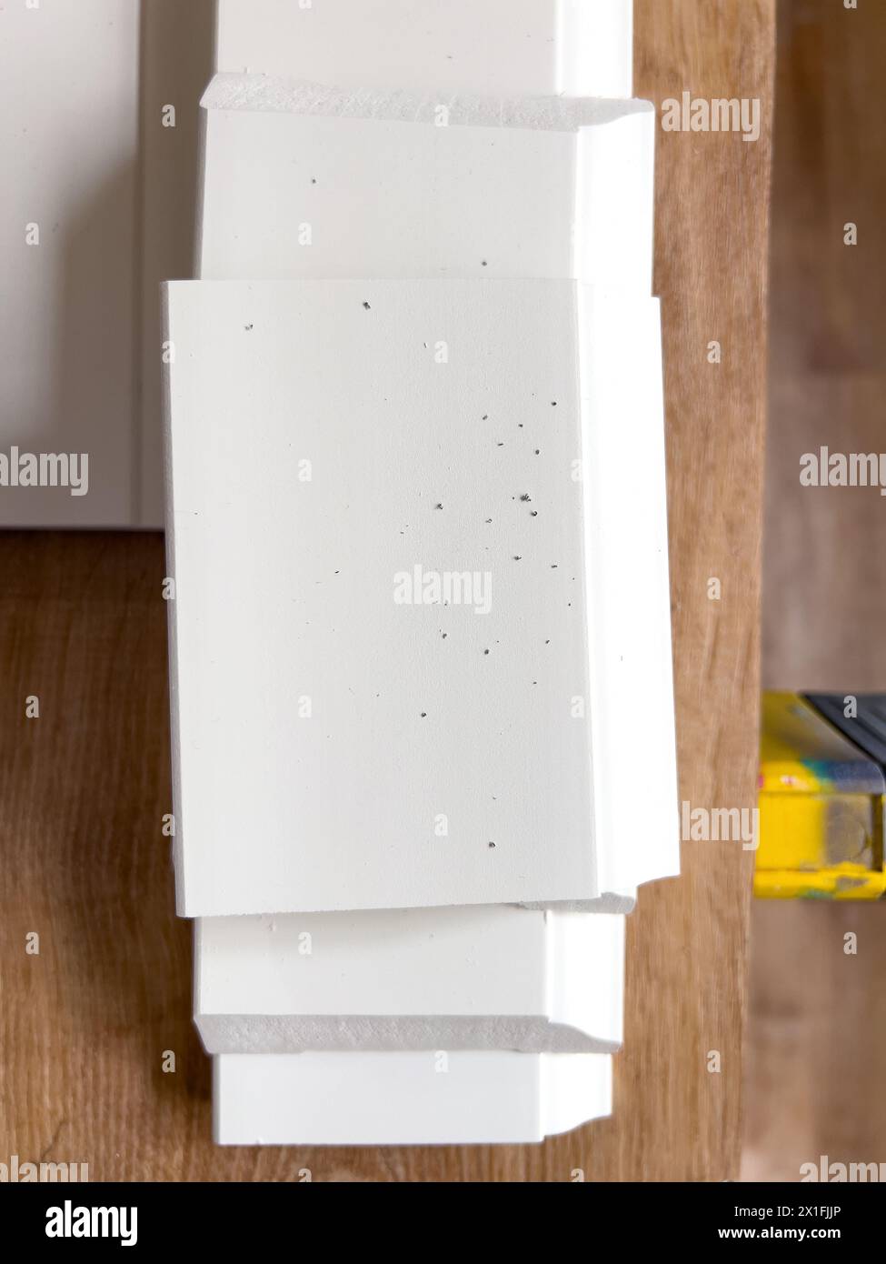 Installing Vinyl Baseboards in a Modern Home Renovation Project Stock ...