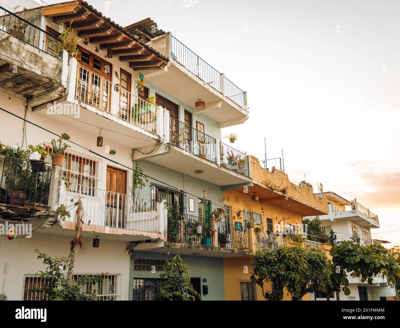 Typical Mexican style apartment flats with balconies with colorful ...