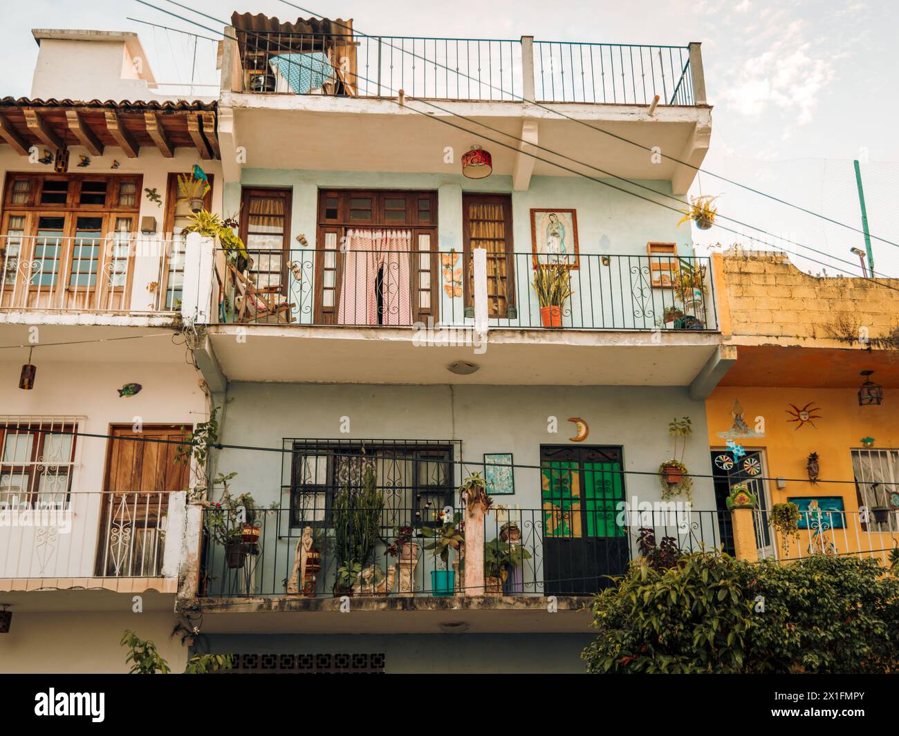 Typical Mexican style apartment flats with balconies with colorful ...