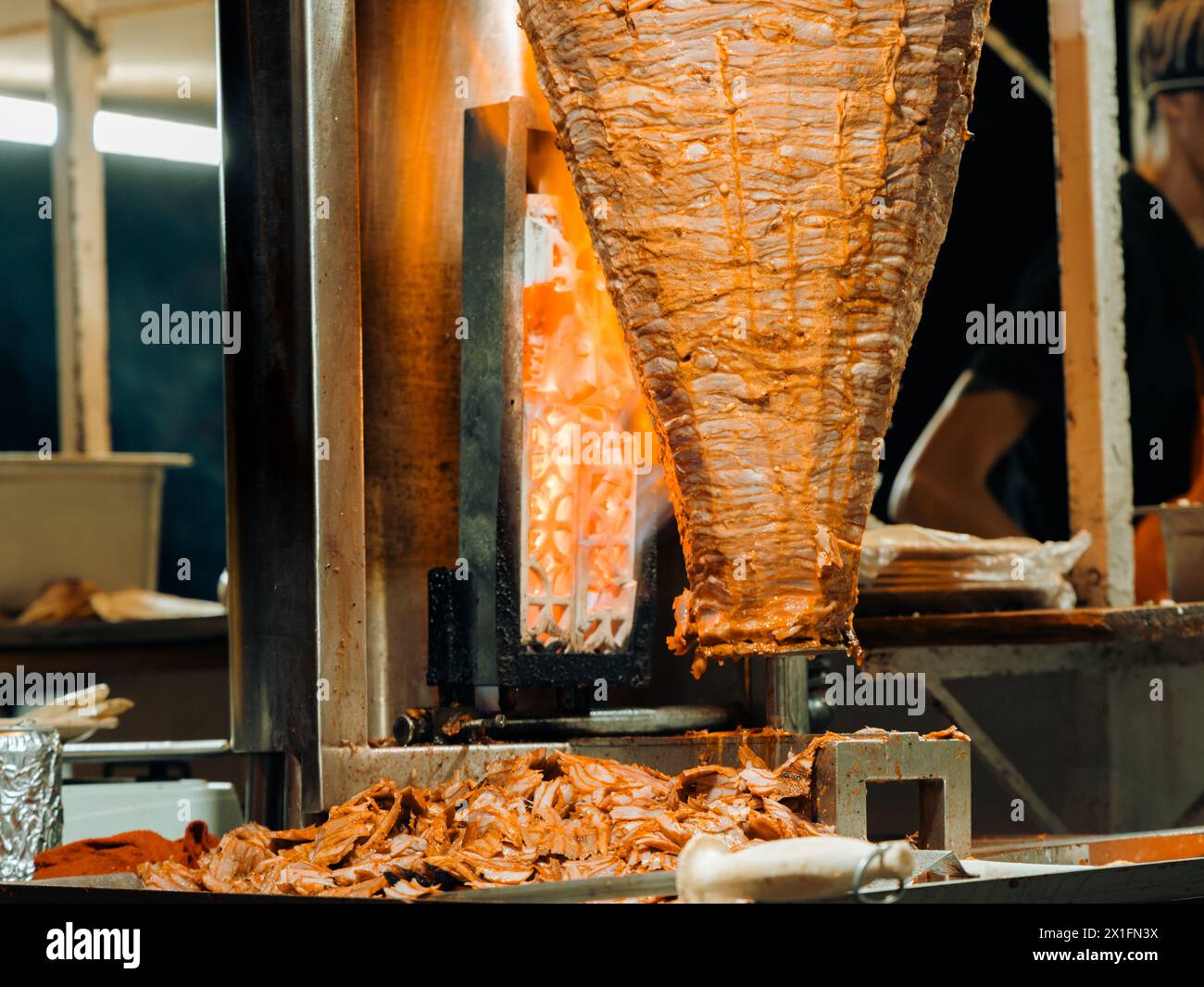 Horizontal low closeup grilling traditional trompo al pastor street ...