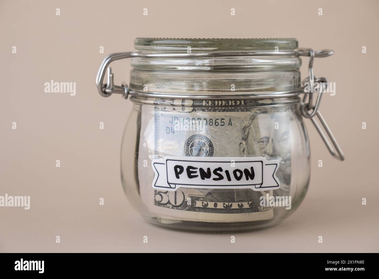 Glass jar full of American currency dollars cash banknote with text ...