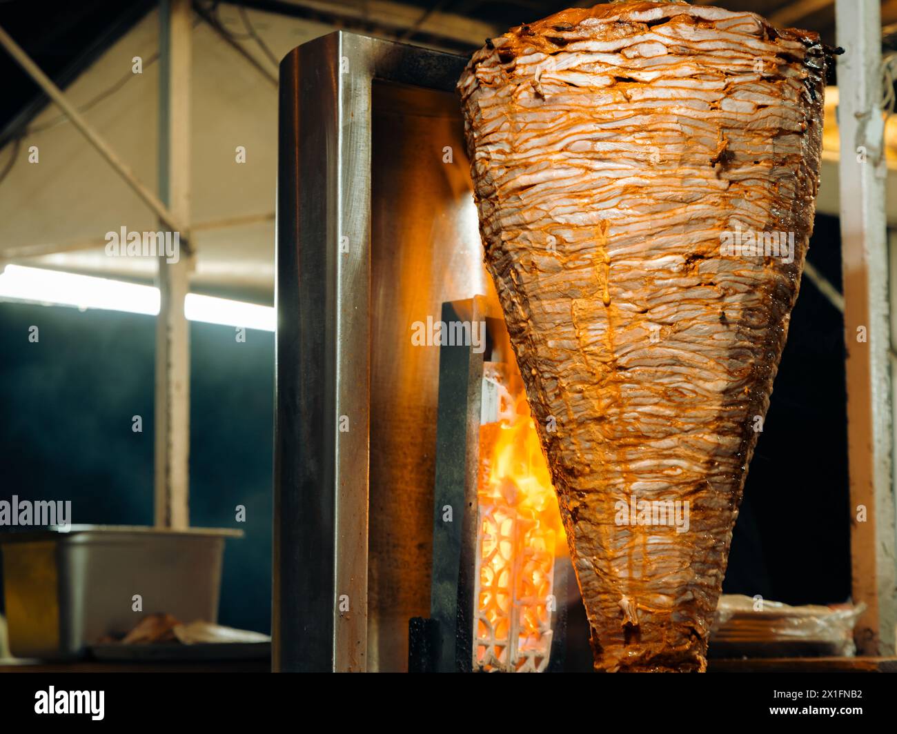 Grilling traditional trompo al pastor street taco pork meat on spit ...