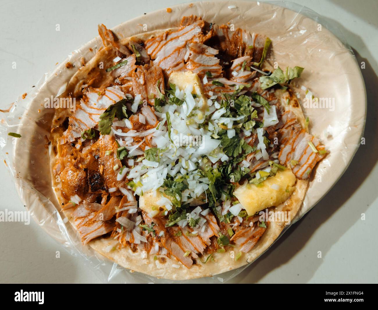 Top view of large plate Mexican al pastor street tacos with cilantro ...