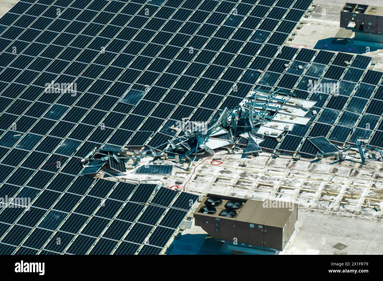Aerial view of damaged by hurricane wind photovoltaic solar panels ...