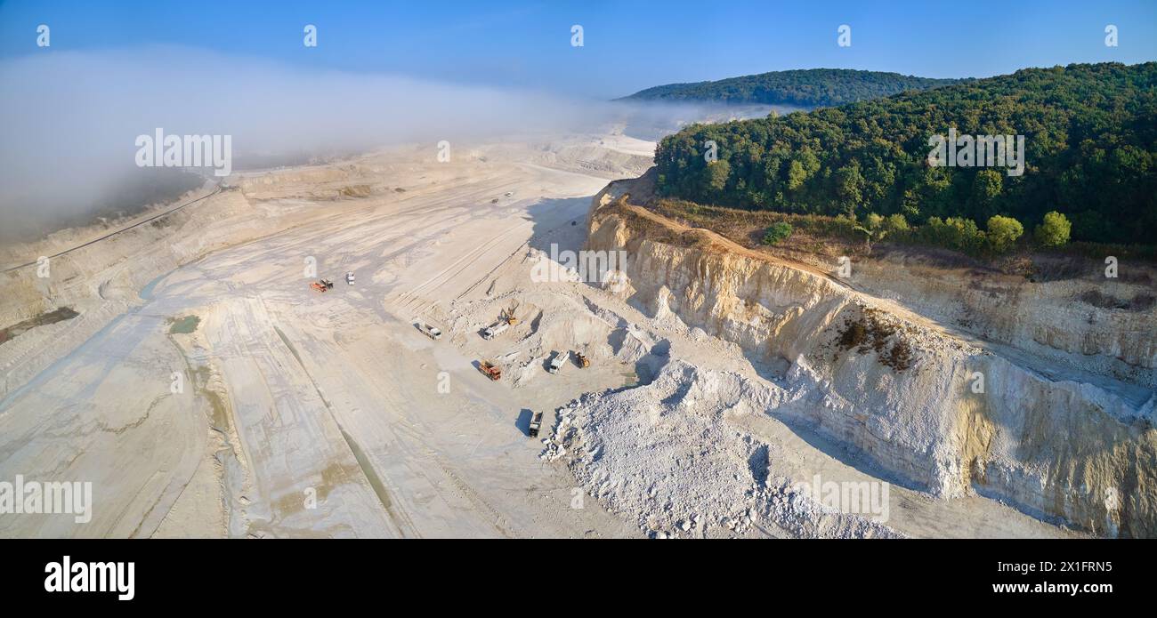 Aerial view of open pit mining of limestone materials for construction ...