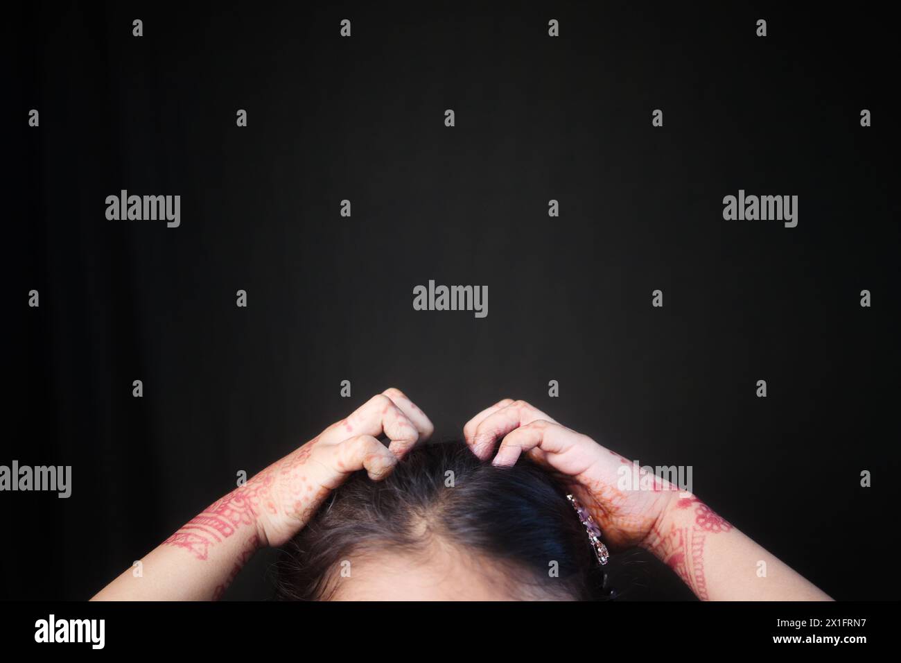 kid Scratching her Head against black background Stock Photo - Alamy