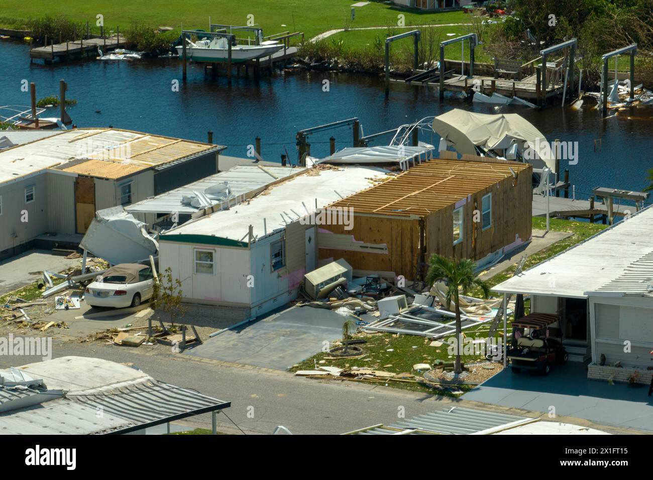 Aftermath of natural disaster in southern Florida. Badly damaged mobile ...