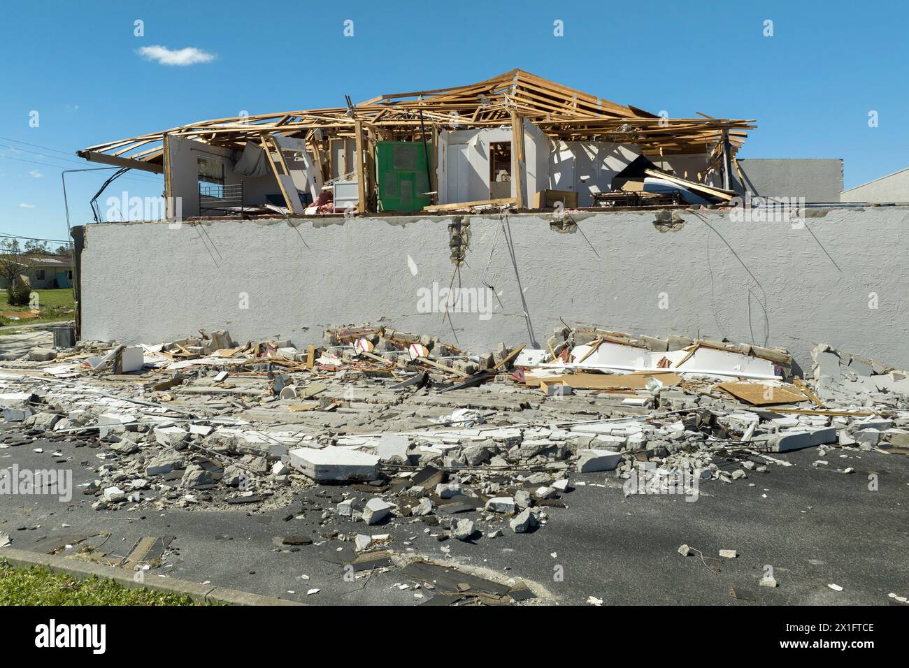 Consequences of natural disaster. Damaged house roof with missing ...