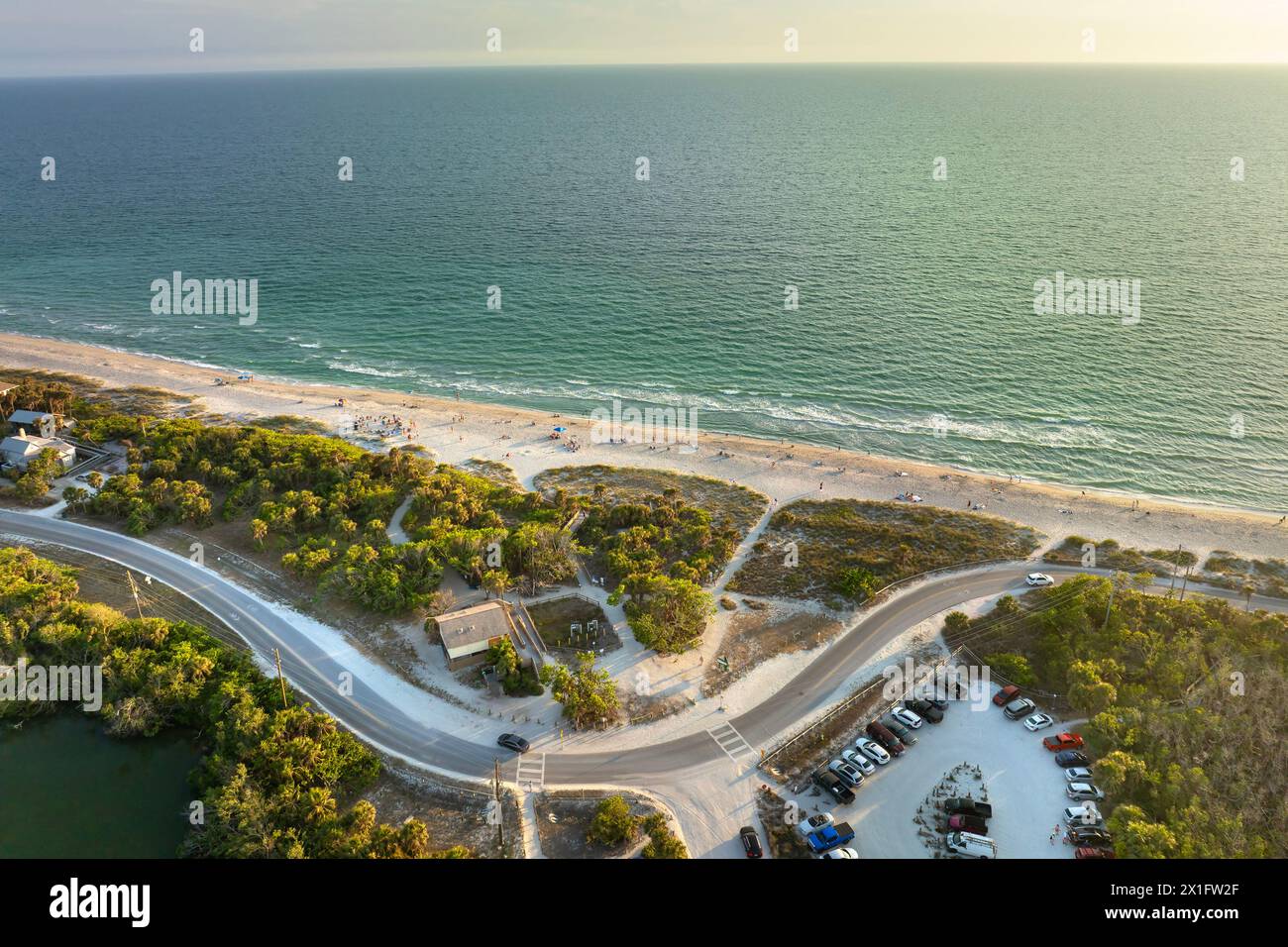 Parking lot at Blind Pass beach on Manasota Key in Englewood. Tourists ...