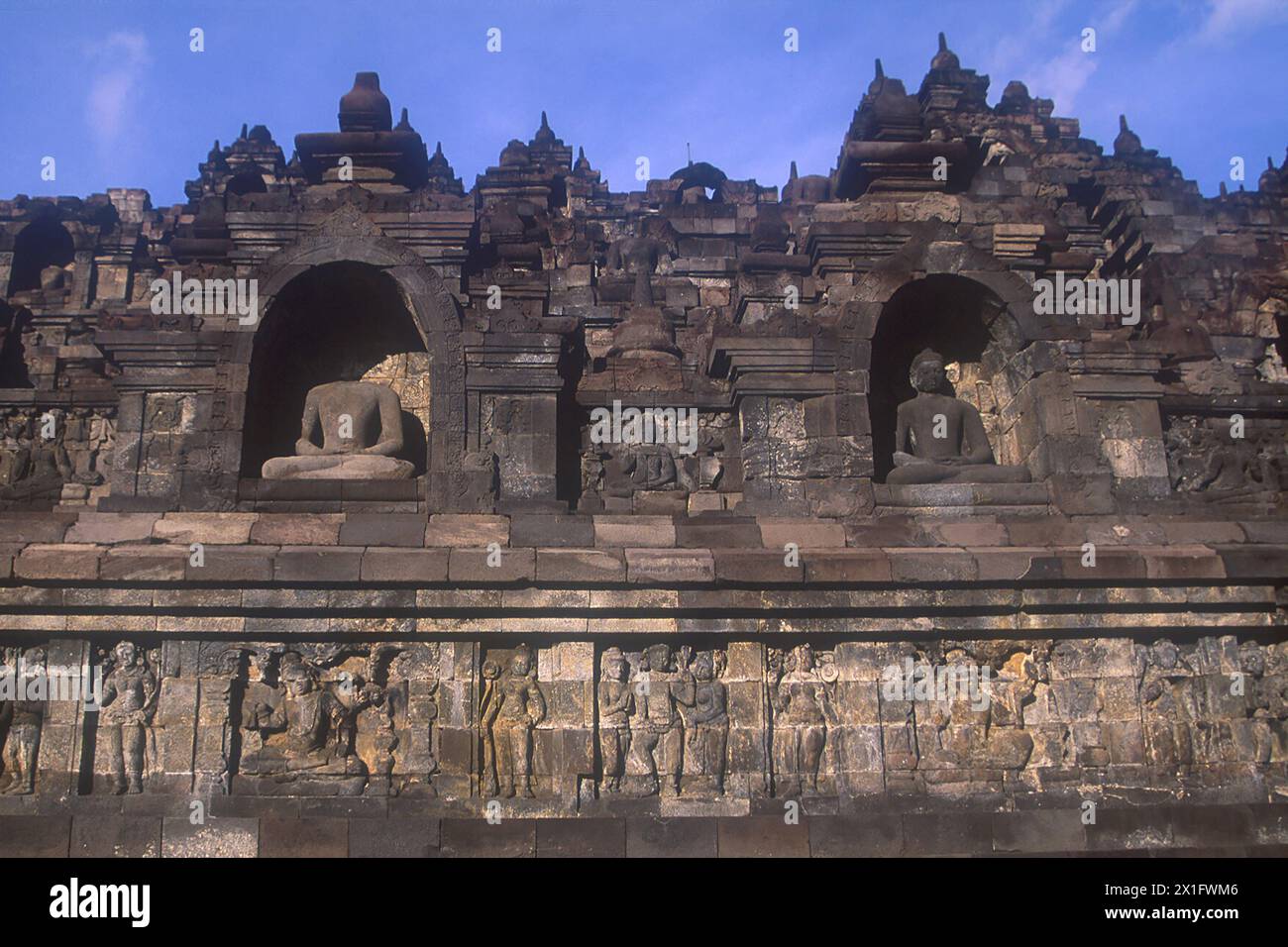 Buddha statue with Kamadhatu relief, Borobudur Temple, Central Java ...