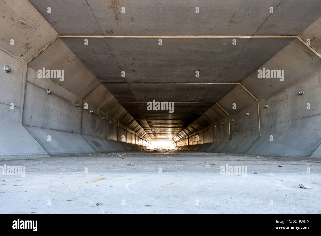 Focus stacked image inside a concrete box culvert under a road for ...