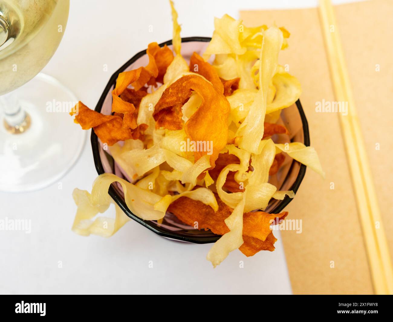 Pile of vegetable chips of sweet potato and yuca in bowl Stock Photo ...