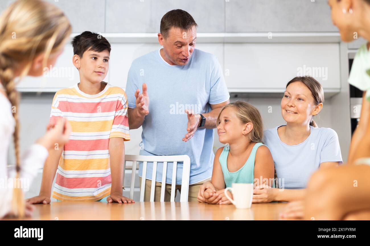 Big family discussing Stock Photo - Alamy