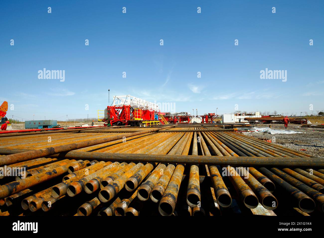 Oil pipe and oil drilling rig equipment Stock Photo - Alamy