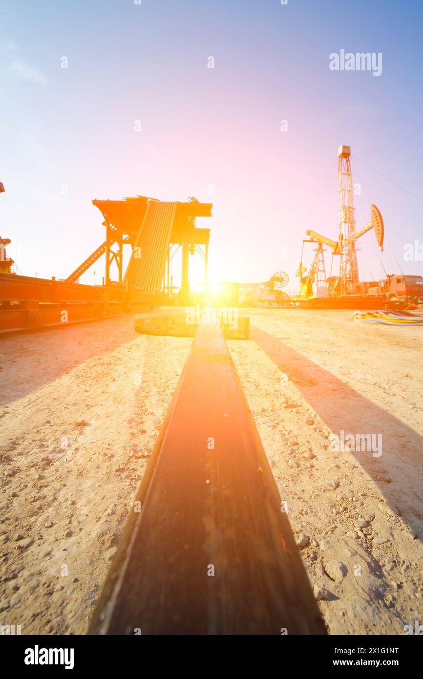 Oil pipe and oil drilling rig equipment Stock Photo - Alamy