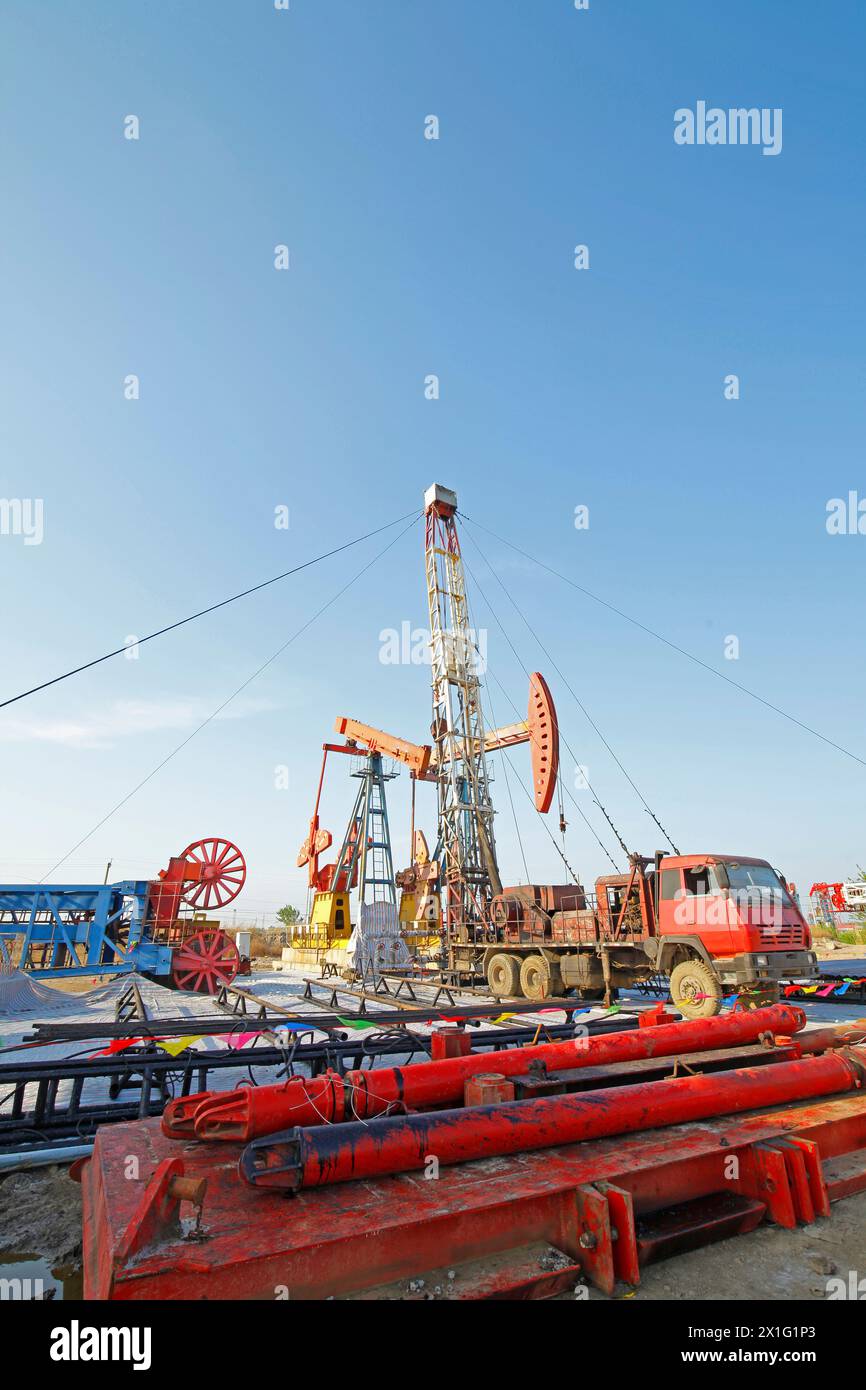 Oil pipe and oil drilling rig equipment Stock Photo - Alamy