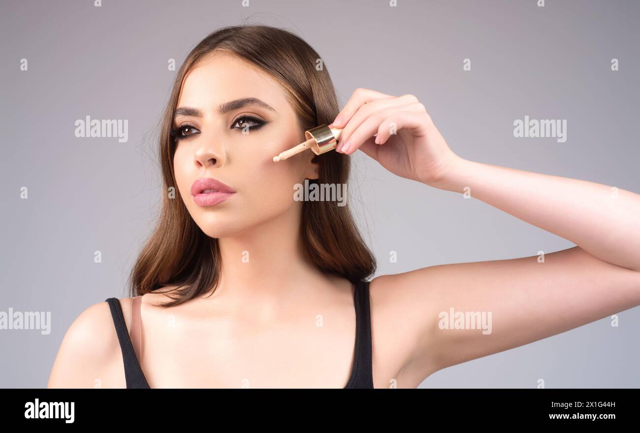 Dropping serum collagen moisturizer. Beauty woman dripping moisturizing ...