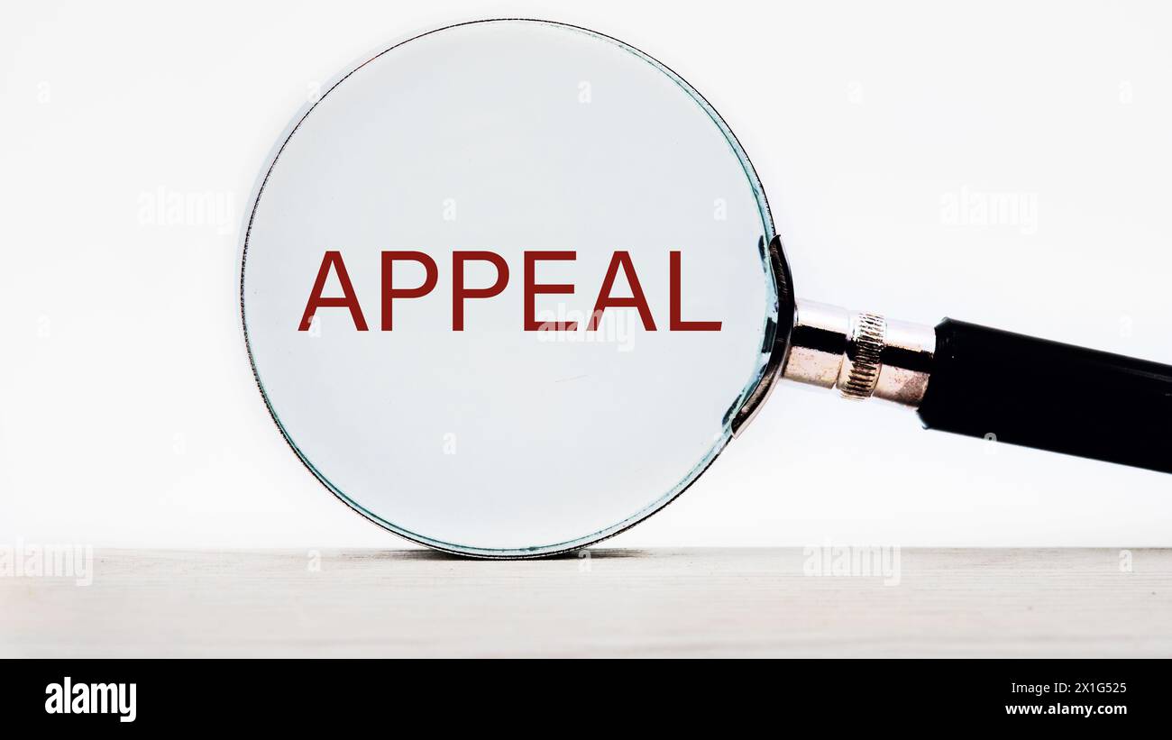 Appeal word text appeared through a magnifying glass on a white ...