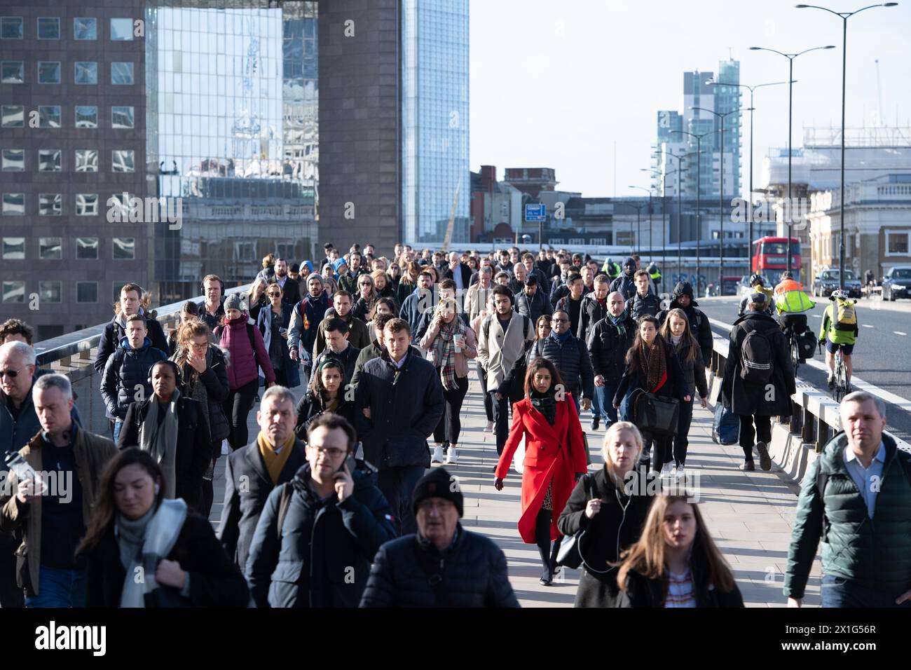 File photo dated 13/03/2020 of commuters crossing London Bridge, in ...