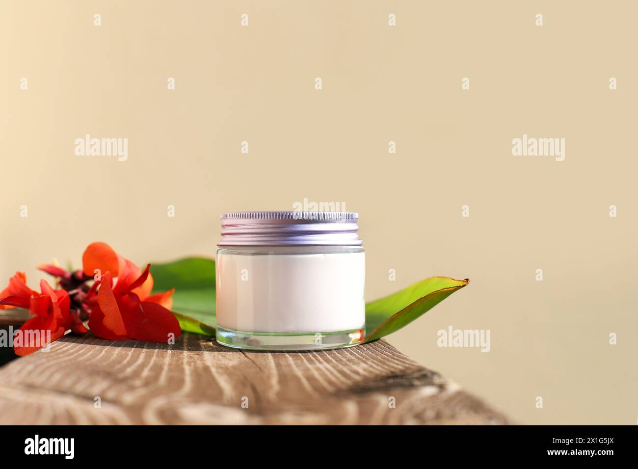 Glass cosmetic jar with white cream and metal screw cap and large ...