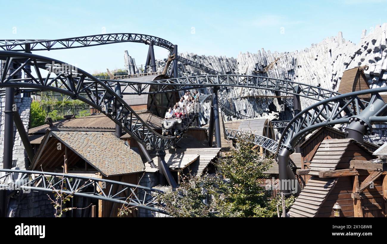 Young people have fun on a ride on the "Taron" rollercoaster in the ...